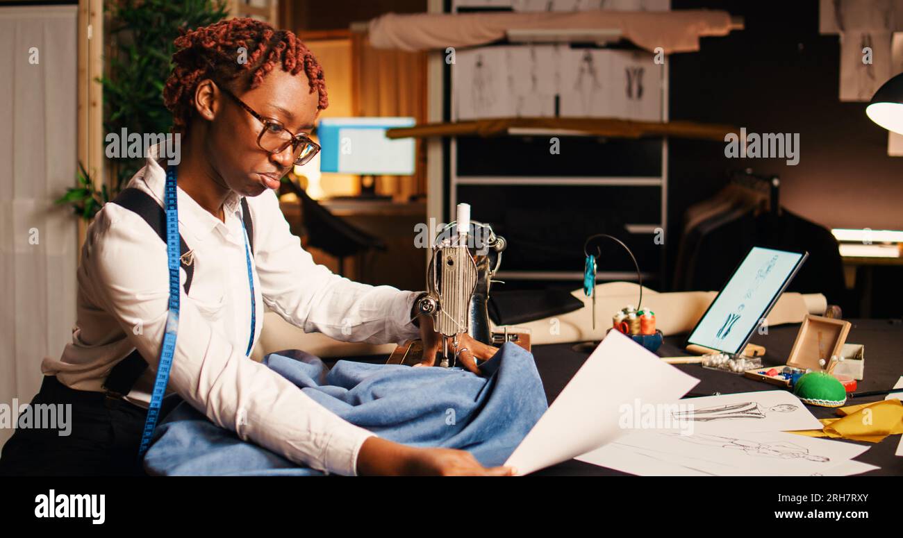 African american tailor using fabric hi-res stock photography and ...