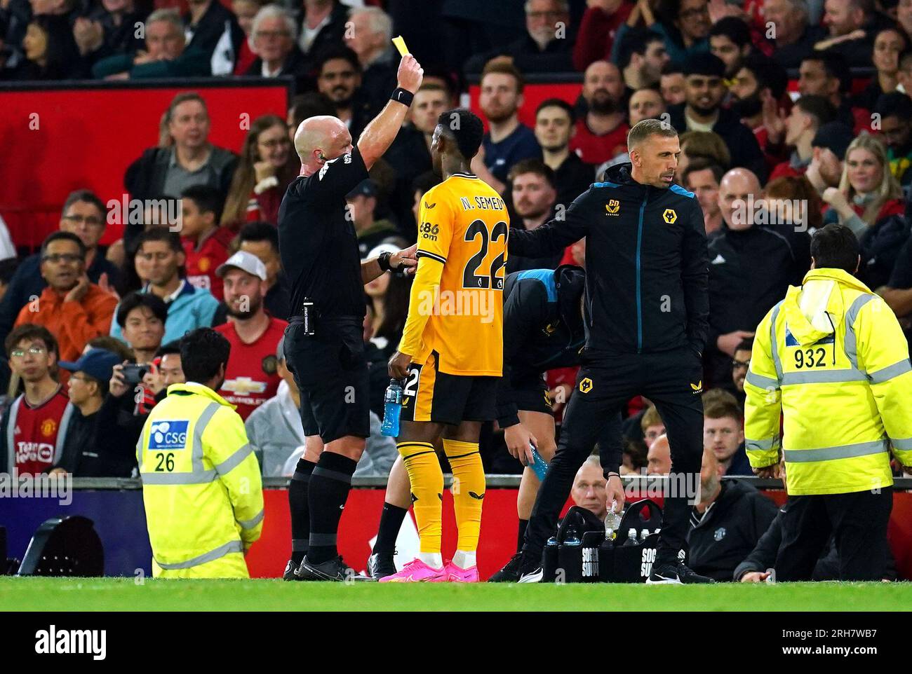 Wolverhampton Wanderers manager Gary O'Neil (right) is shown a yellow ...