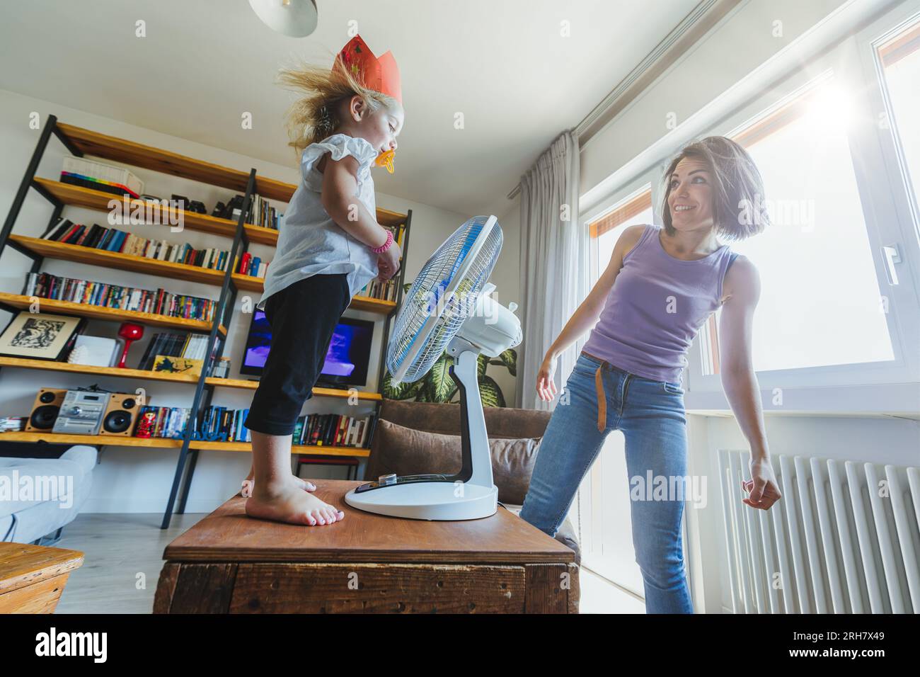 Mother and daughter transform a sweltering day into joy with playful ...