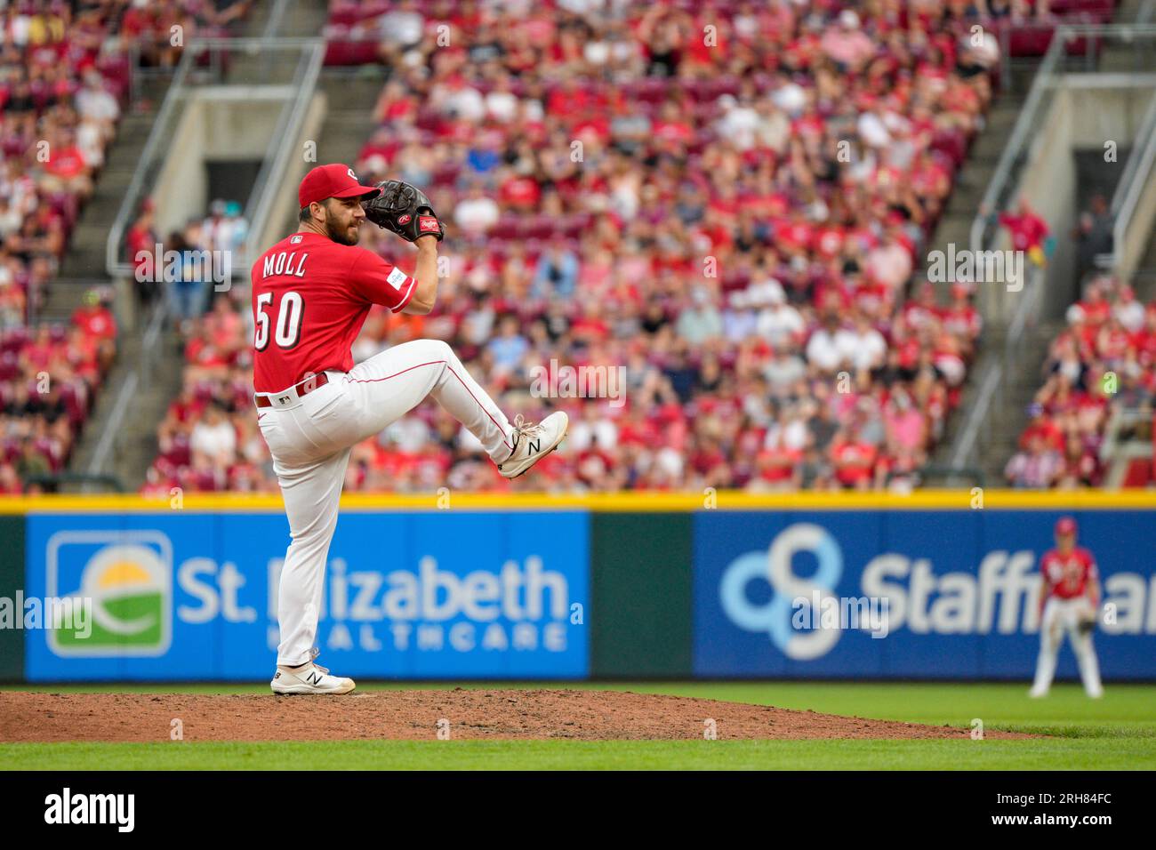 Cincinnati Reds relief pitcher Sam Moll (50) throws during a baseball ...