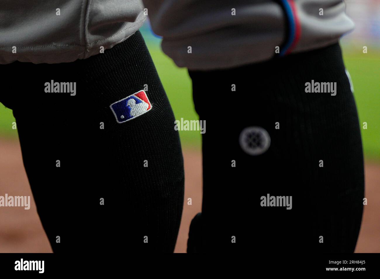 The MLB logo is seen on the socks of a Miami Marlins player during a ...