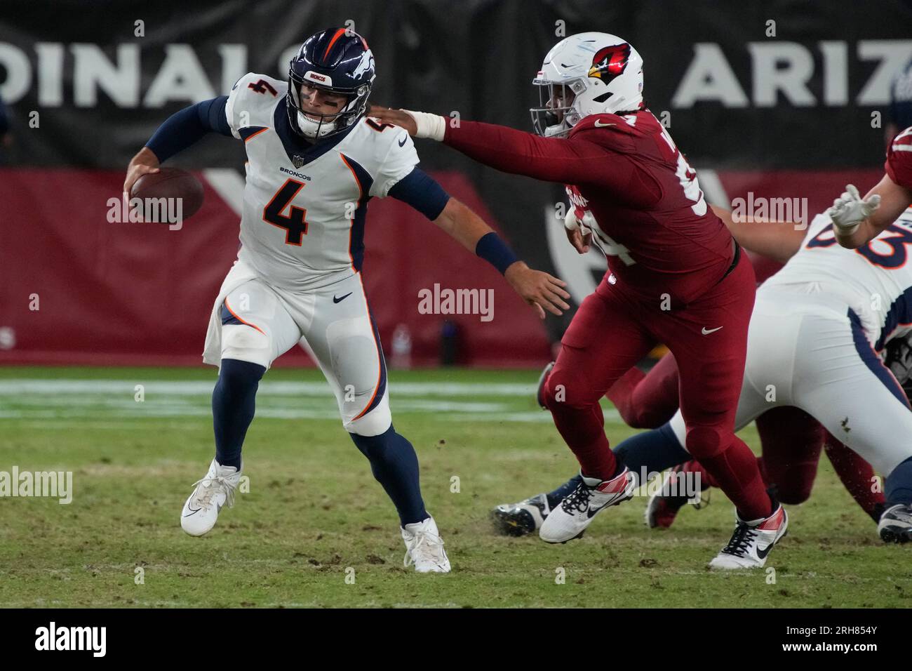 Denver Broncos quarterback Jarrett Stidham (4) scrambles during an NFL ...