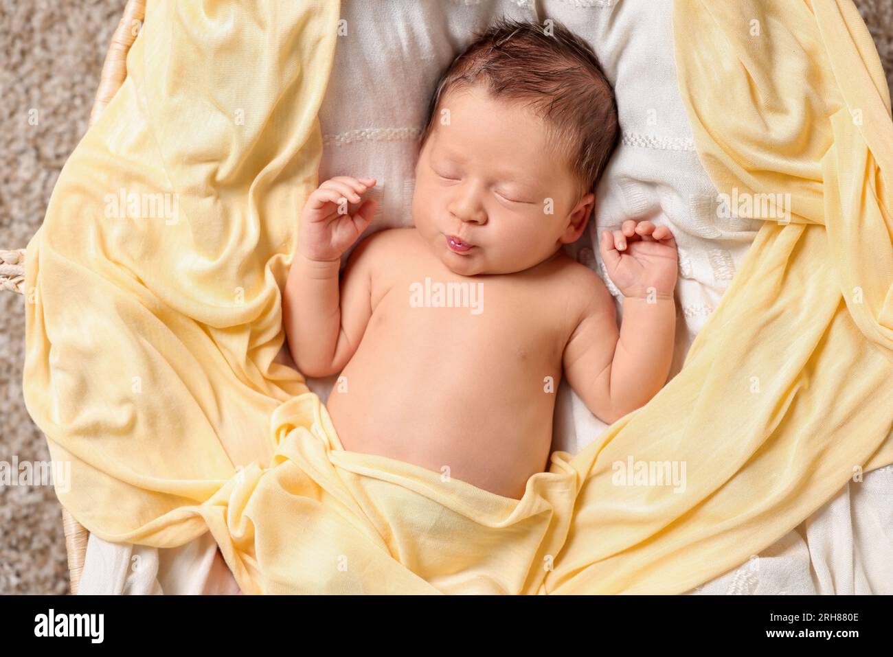 Cute newborn baby sleeping on white blanket in crib, top view Stock ...
