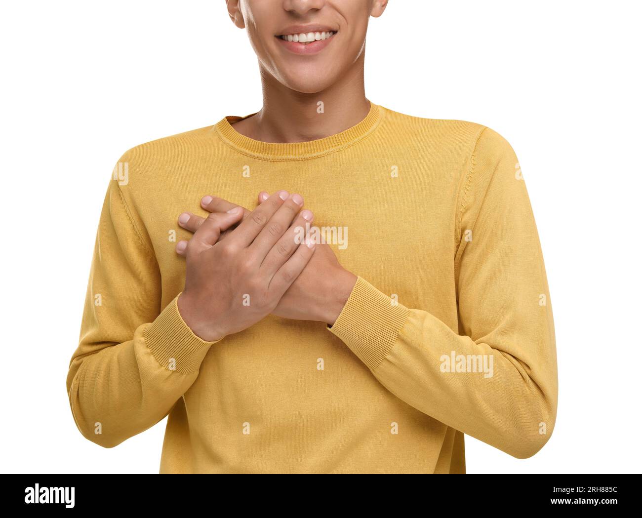 Thank you gesture. Grateful man with hands on chest against white ...