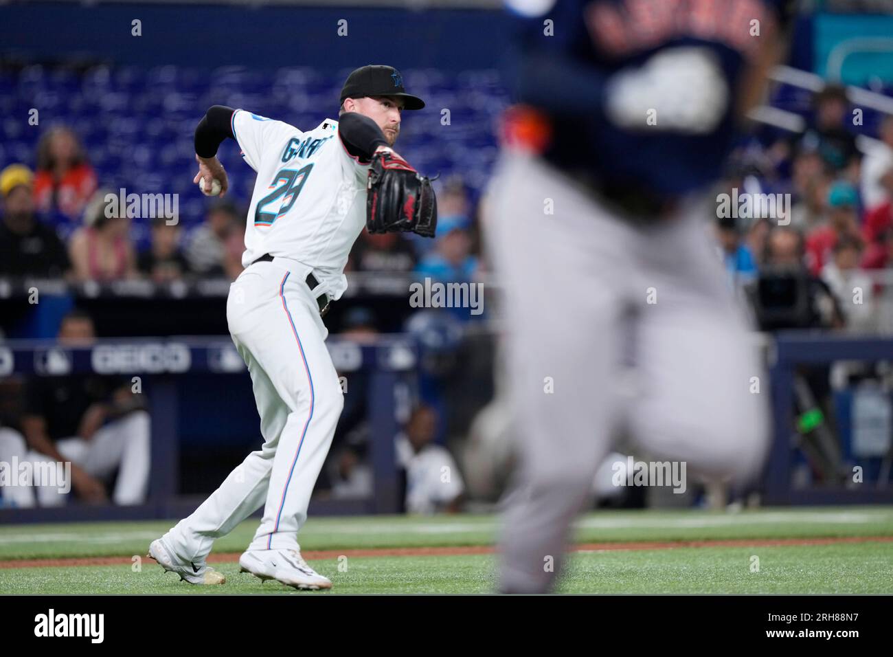 Miami Marlins starting pitcher Braxton Garrett (29) throws to first to ...