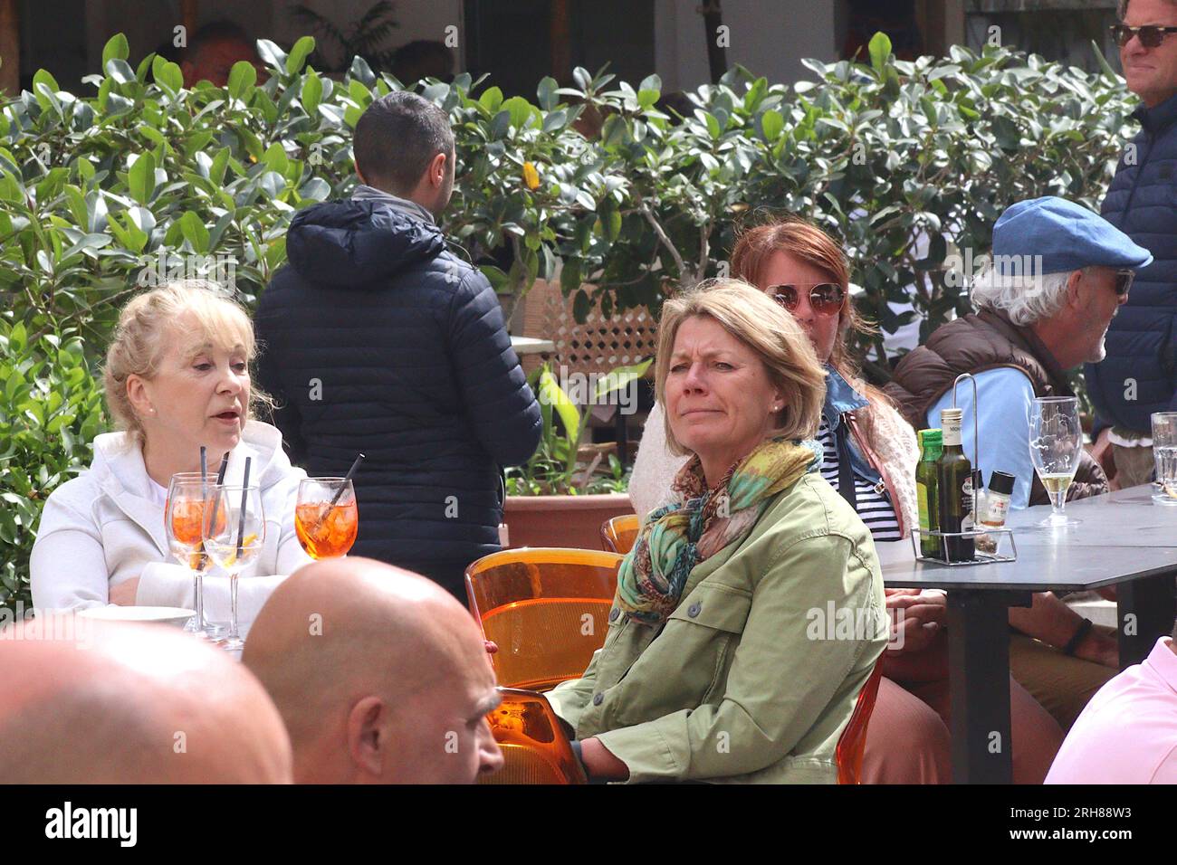 Multi generational groups of individuals, couples and tourists enjoy ...