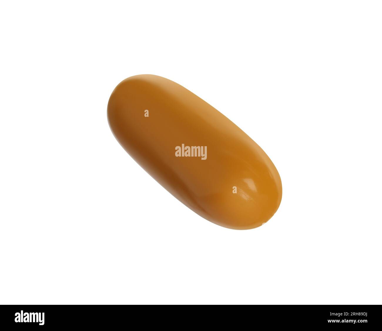 One light brown pill on white background. Medicinal treatment Stock ...