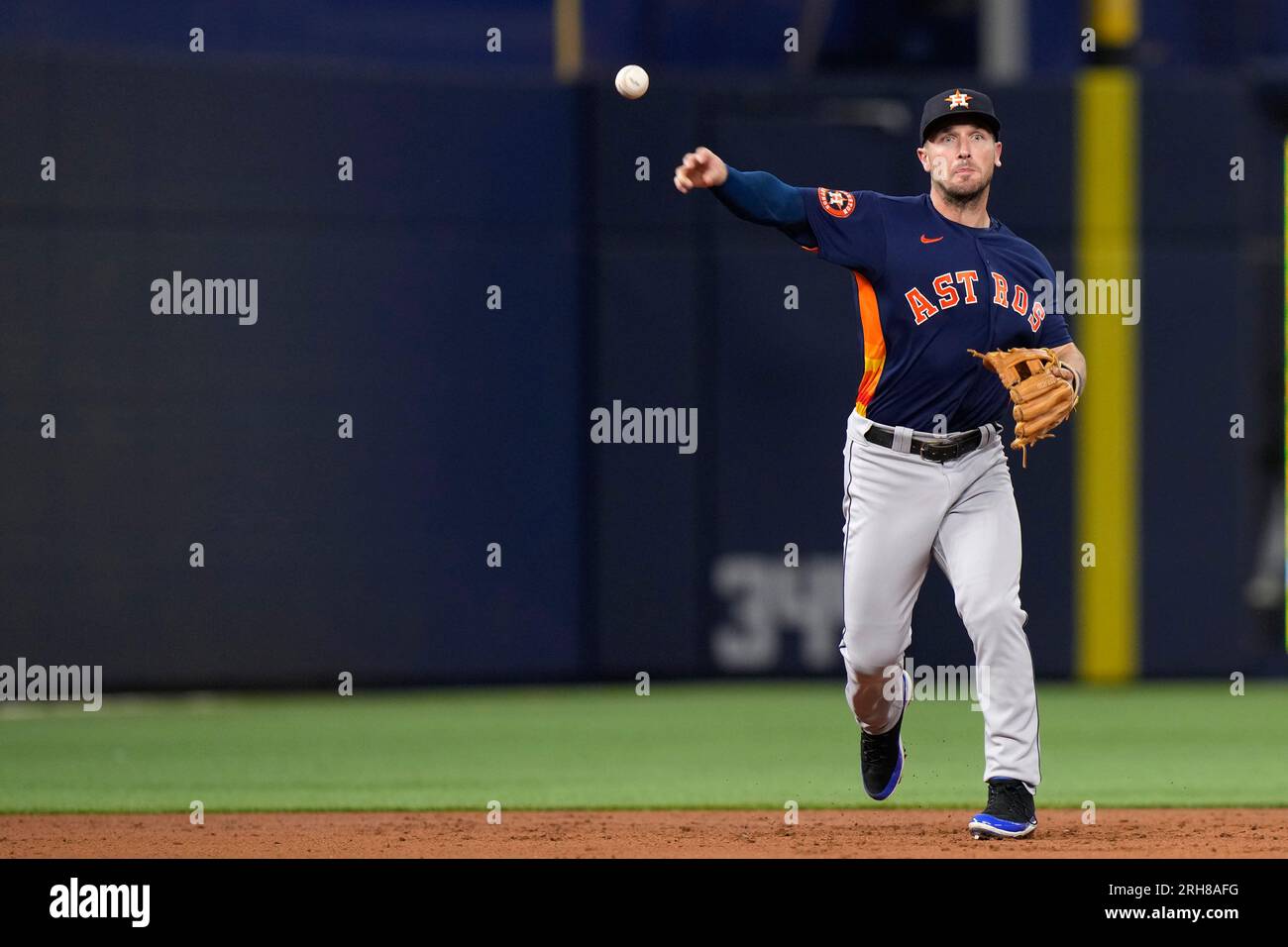 Houston Astros third baseman Alex Bregman throws to first to put out ...
