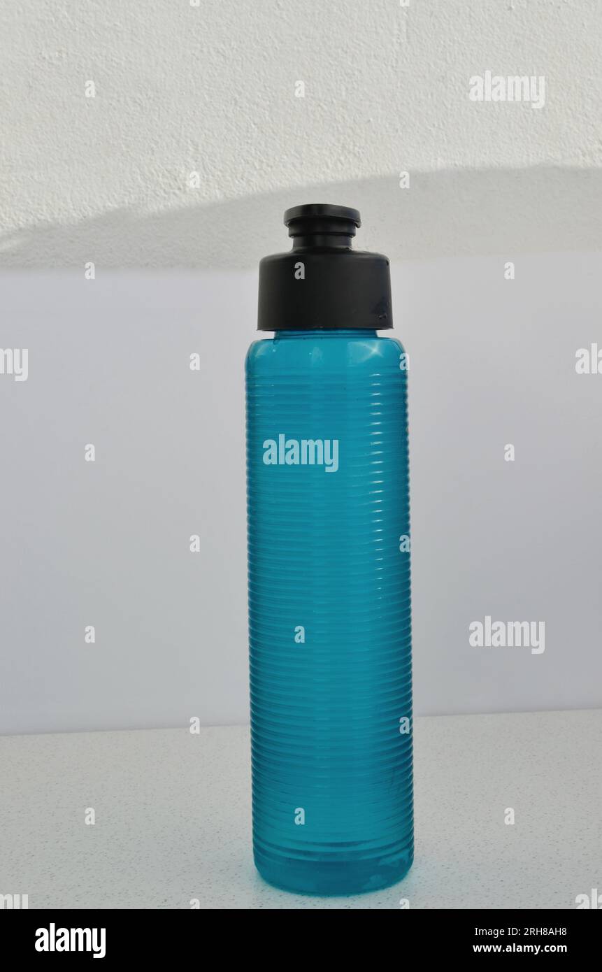 Blue water bottle close-up, ready to hydrate athletes during intense ...