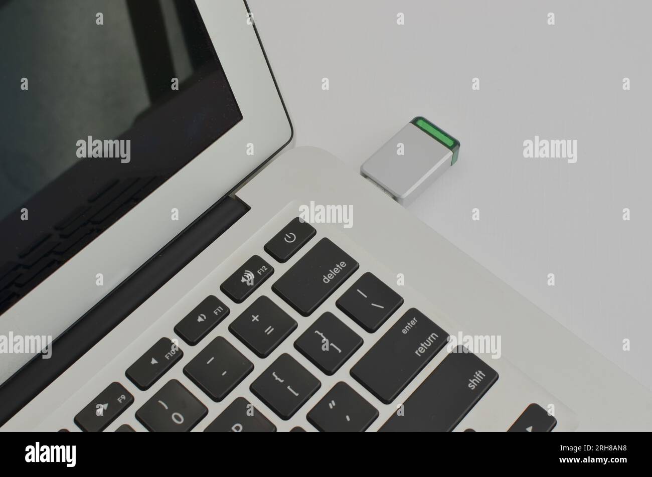 Featured technology concept: USB stick inserted into the laptop, an ...