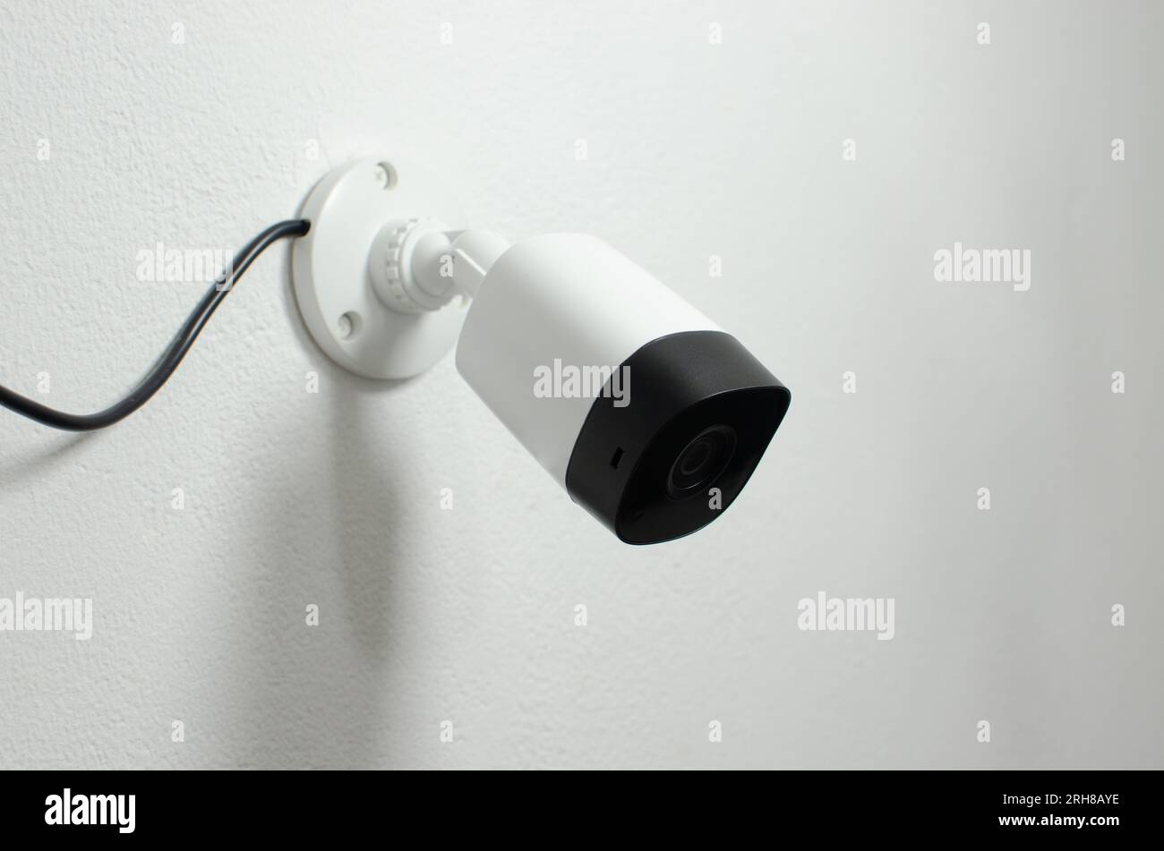Detail of a white security camera, a symbol of monitoring and security ...