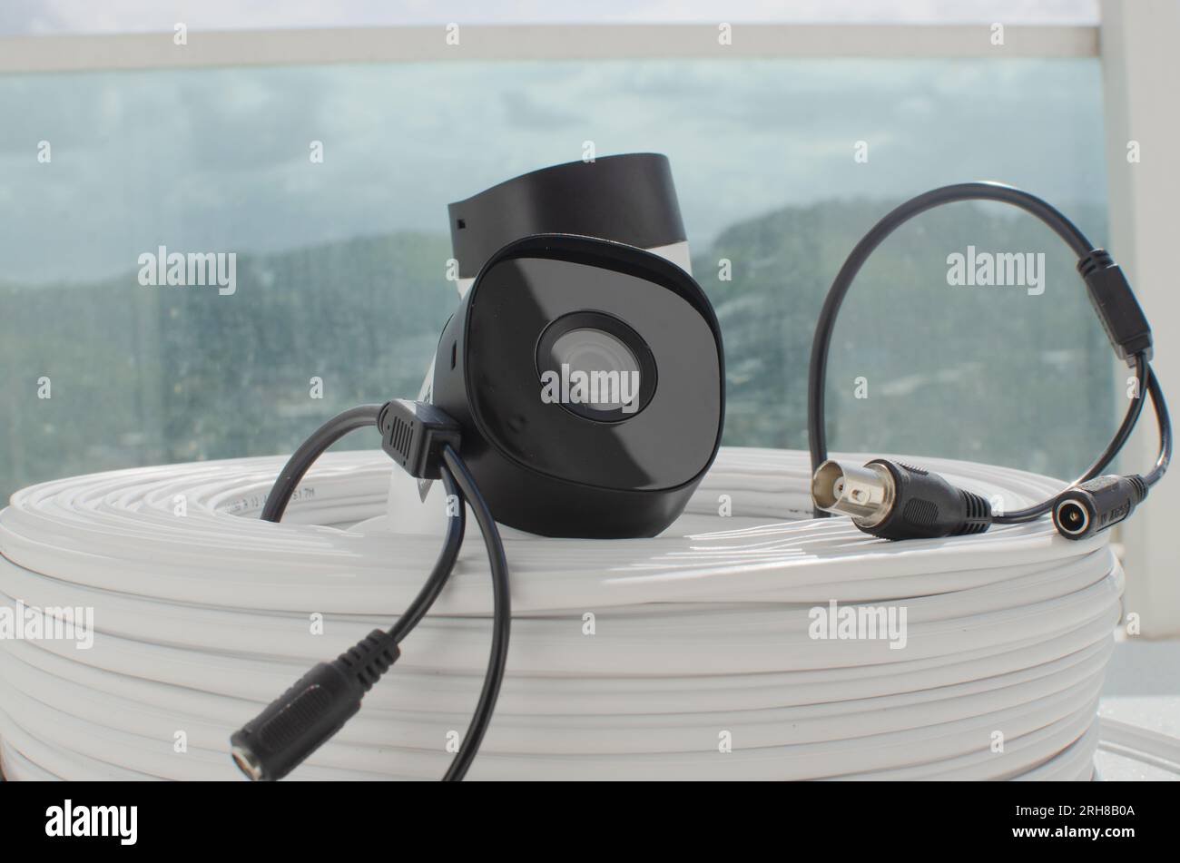 Detail of a security camera with a coil of wire, symbolizing protection ...