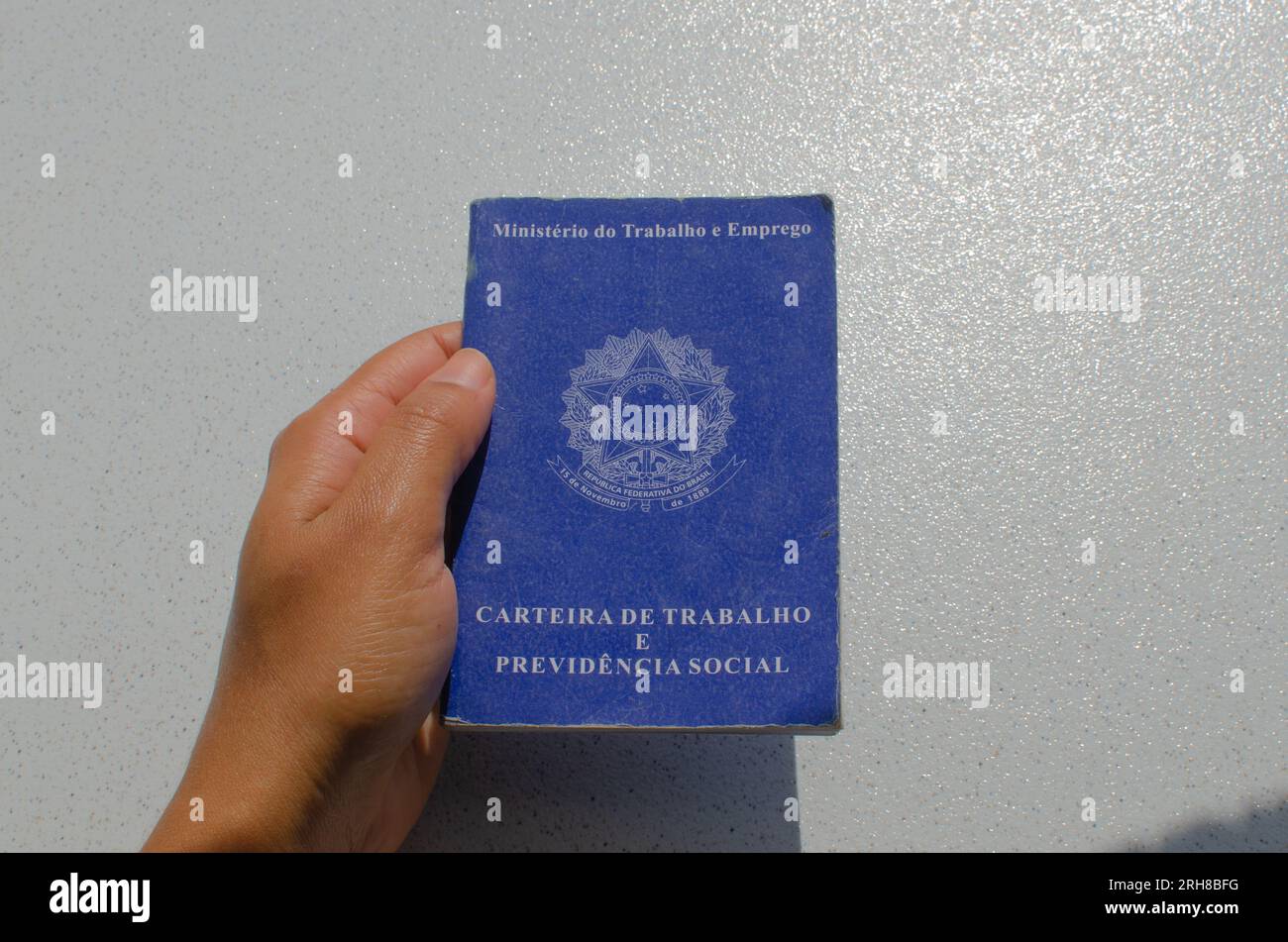 Brazil Work Card - Hand holding the Carteira de Trabalho do Brasil, an ...