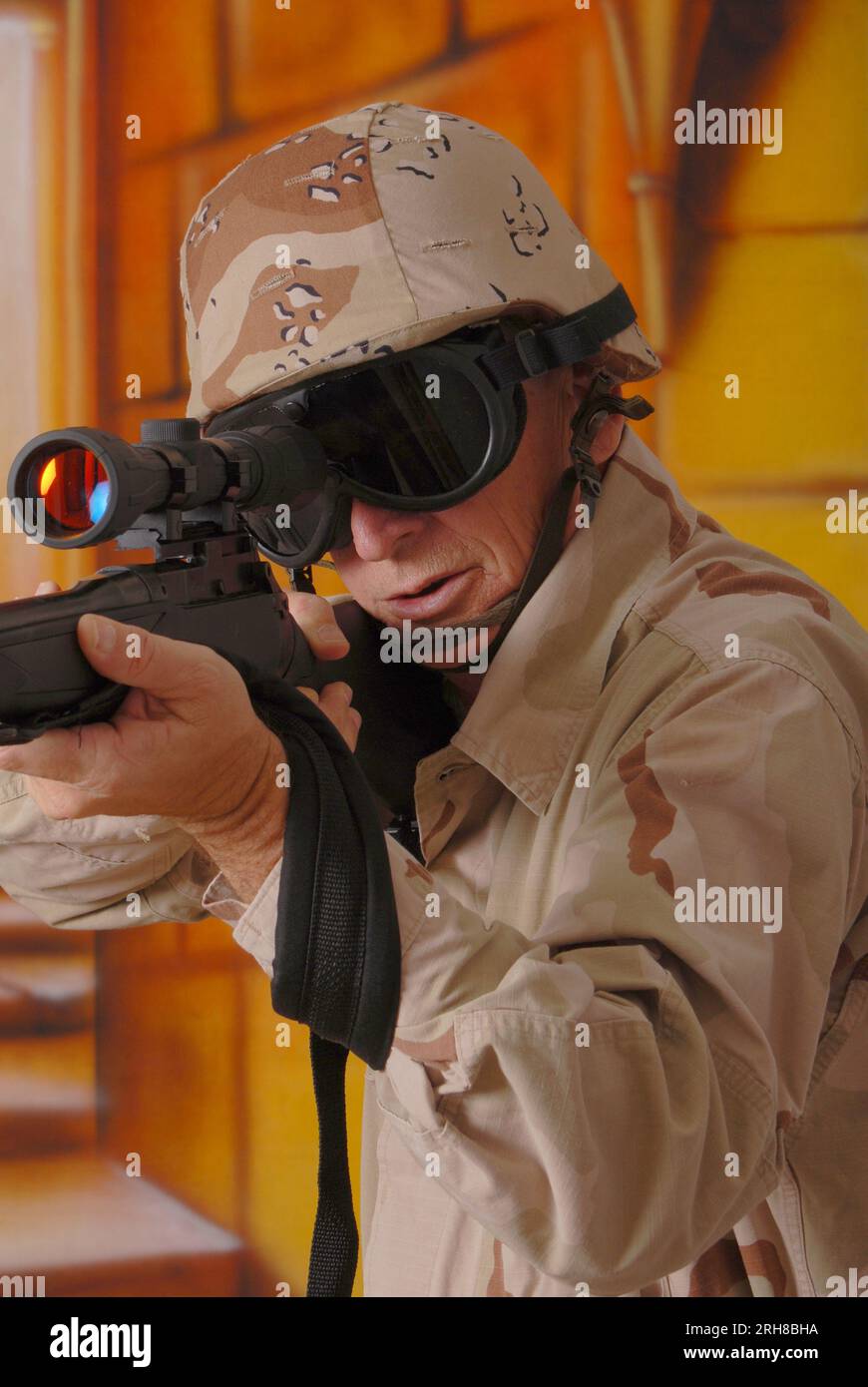 Camouflaged old soldier with sniper rifle inside building Stock Photo ...