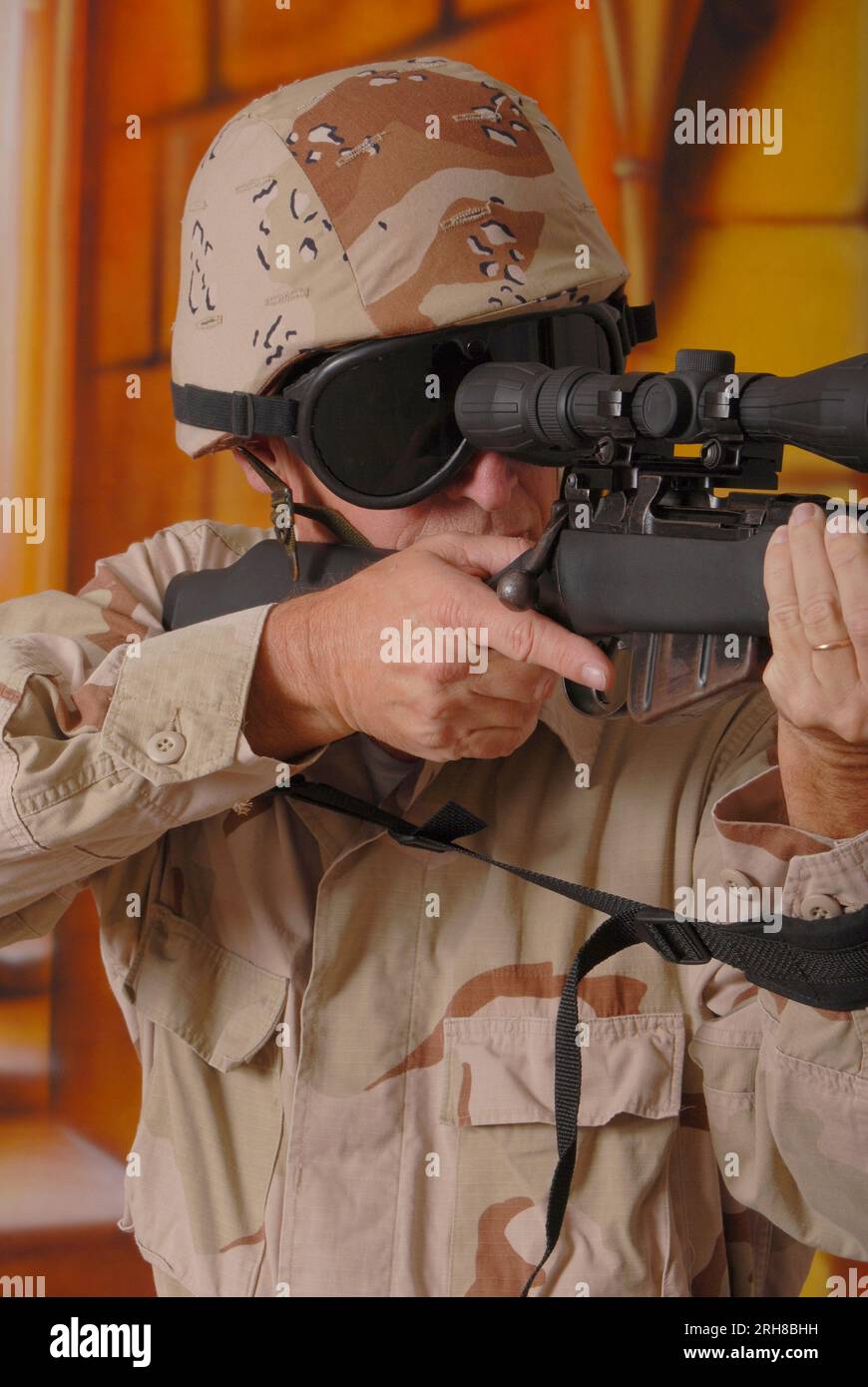 Camouflaged old soldier with sniper rifle inside building Stock Photo ...