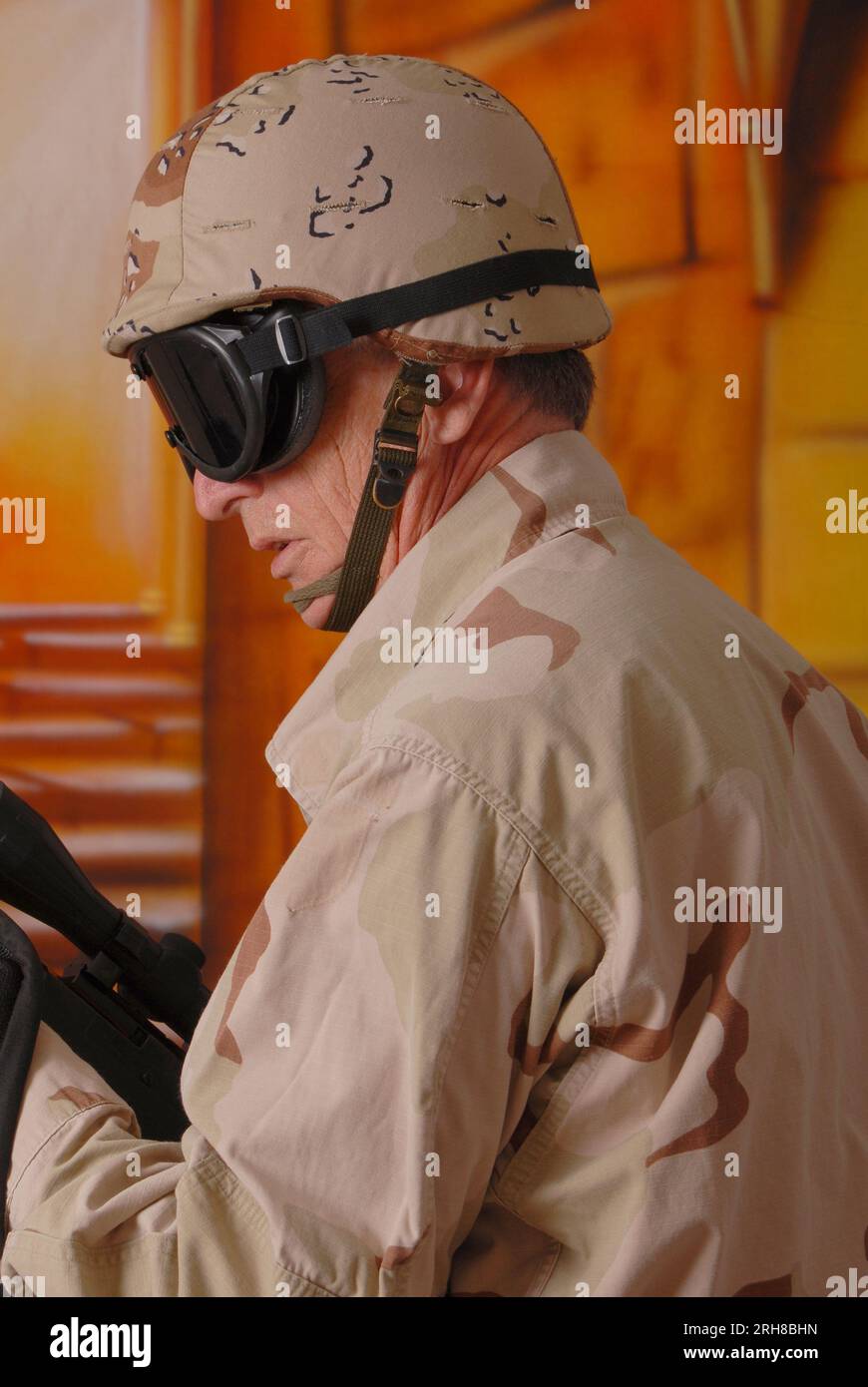 Camouflaged old soldier with sniper rifle inside building Stock Photo ...