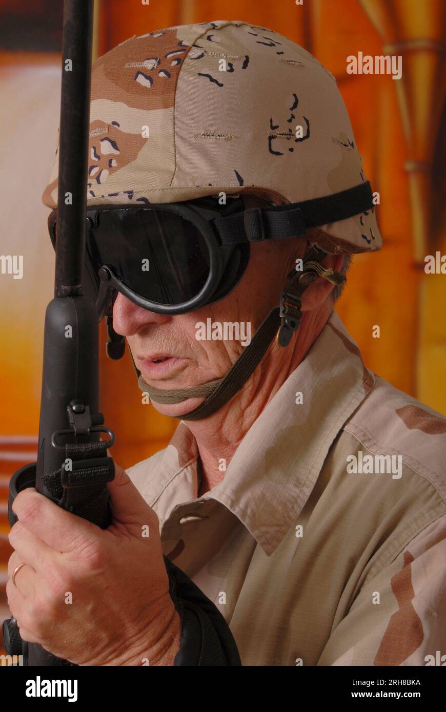 Camouflaged old soldier with sniper rifle inside building Stock Photo ...