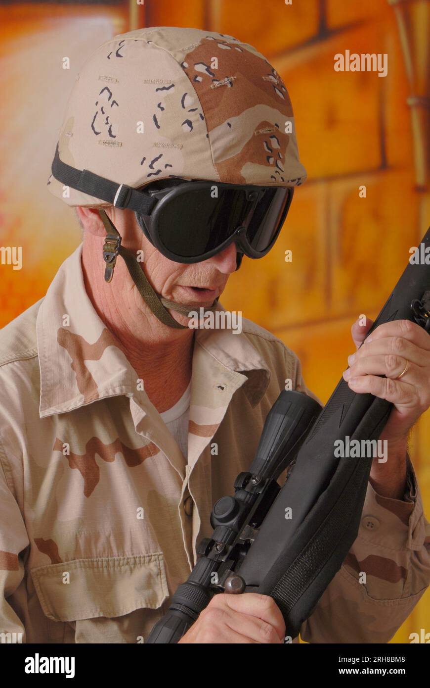 Camouflaged old soldier with sniper rifle inside building Stock Photo ...
