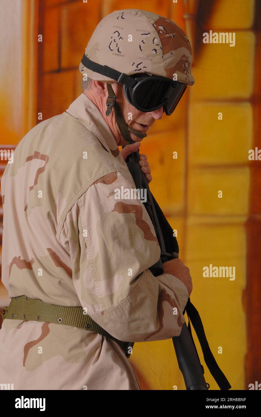 Camouflaged old soldier with sniper rifle inside building Stock Photo ...