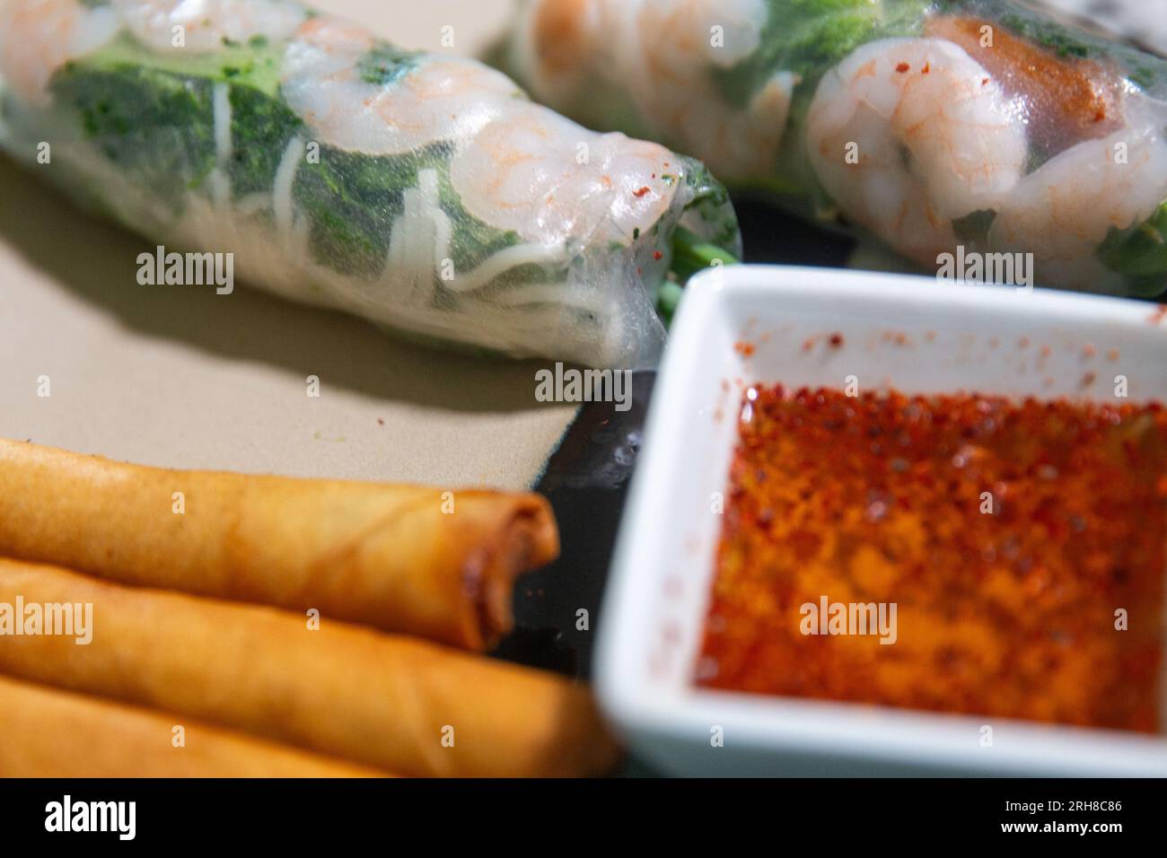Spring rolls and pork loempia with fish sauce Stock Photo - Alamy