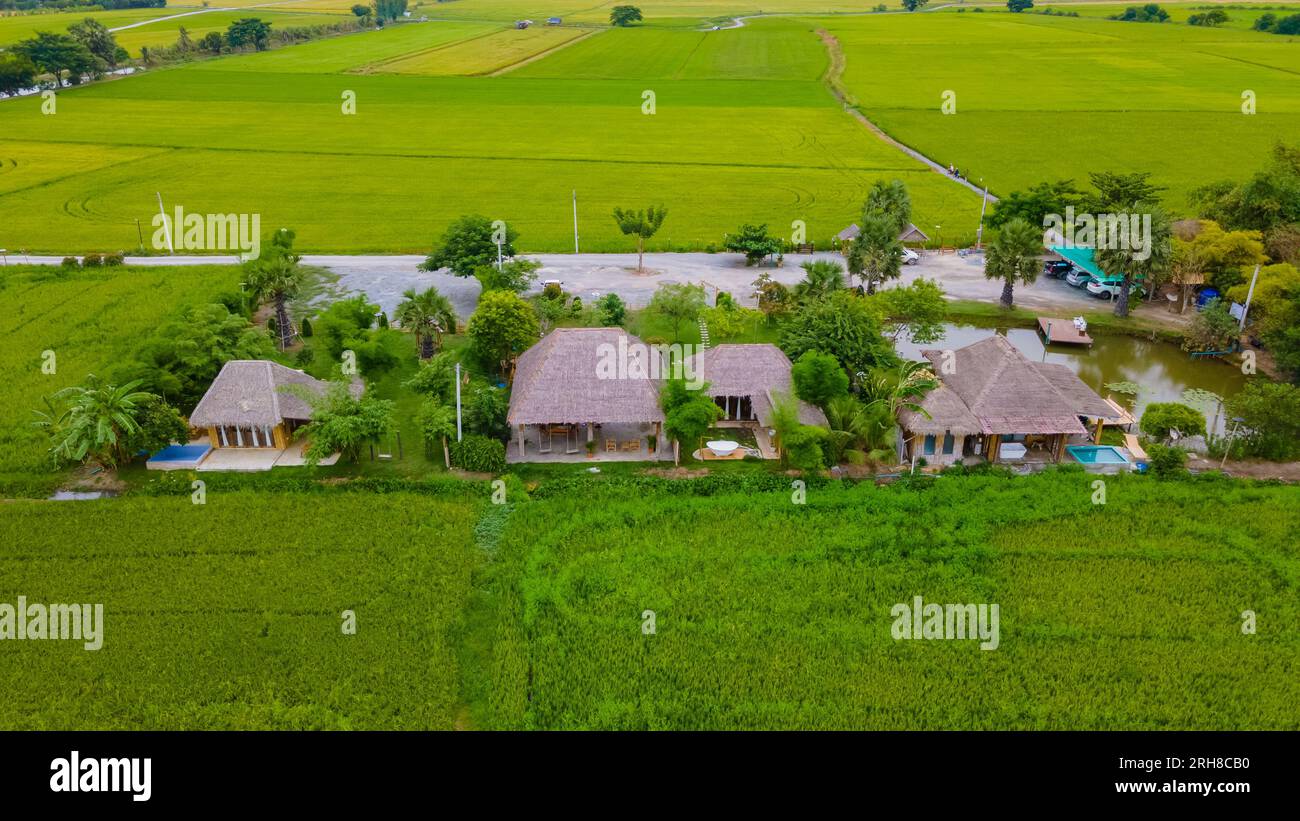 Bamboo hut homestay farm with Green rice paddy fields in Central ...