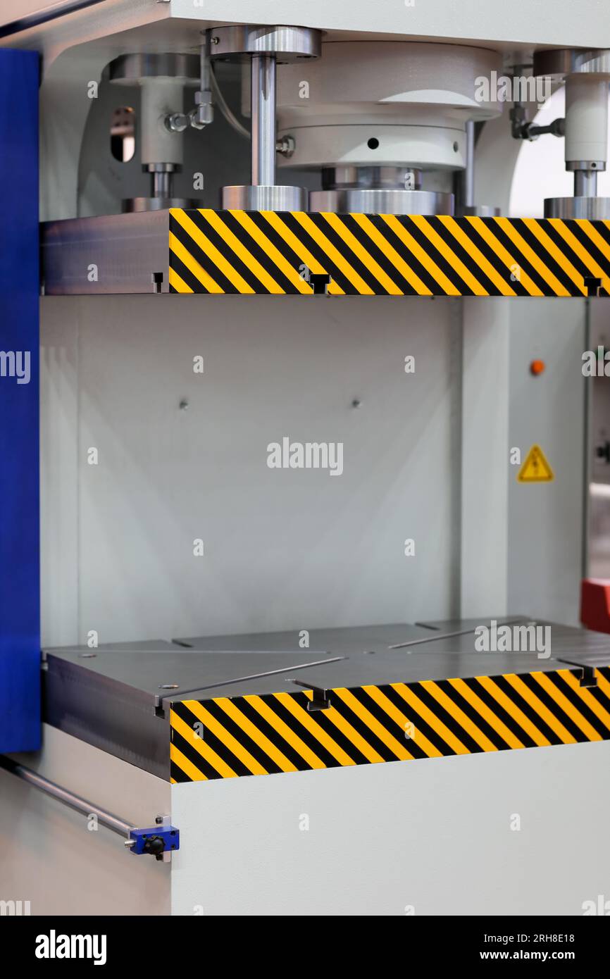 Modern industrial hydraulic press machine. Selective focus Stock Photo ...
