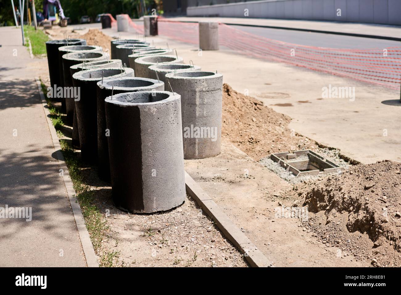 Laying concrete manholes and drain pipes for stormwater system ...