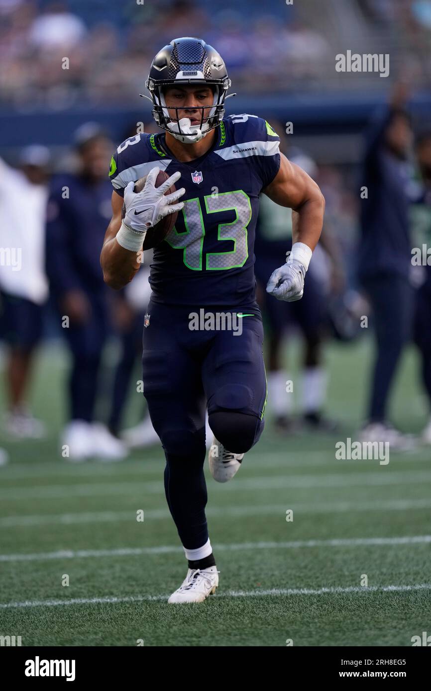 Seattle Seahawks running back Wayne Taulapapa (43) runs with the ball ...