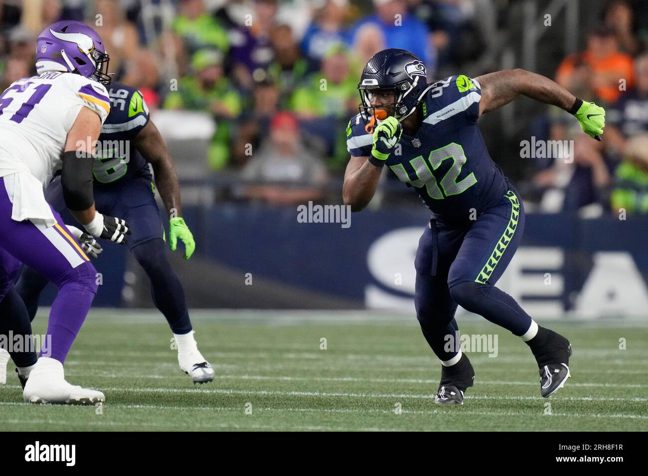 Seattle Seahawks defensive end Jordan Ferguson runs down the field ...