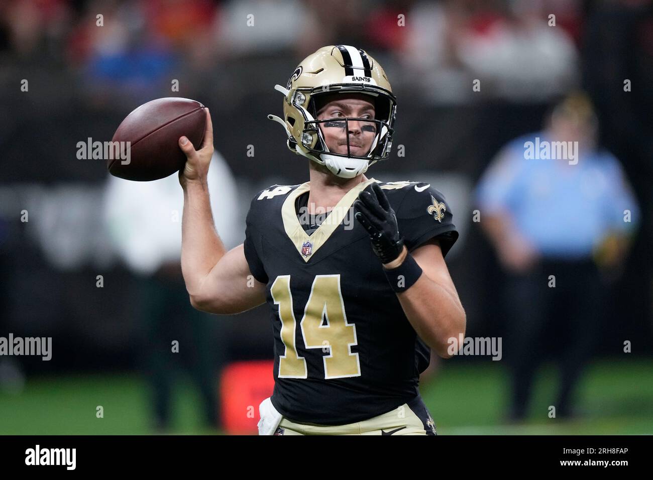 New Orleans Saints quarterback Jake Haener (14) drops back to pass in ...