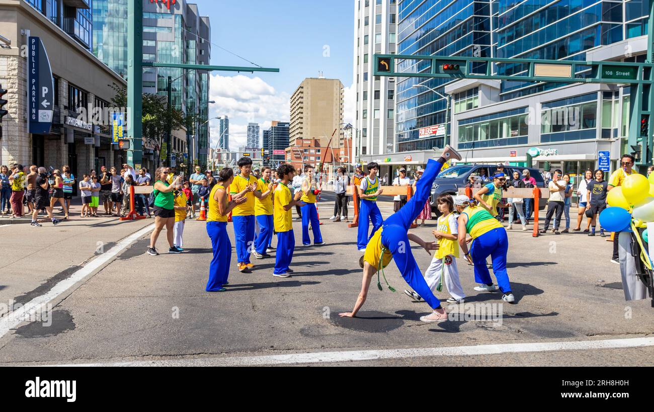 Edmonton, Canada. 13th Aug, 2023. Participants display a form of ...