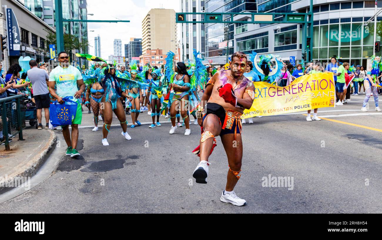 Edmonton, Canada. 13th Aug, 2023. A parade participant shows off his ...