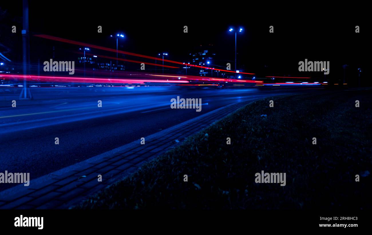 Lights of cars at night. Street line lights. Night highway city. Long ...