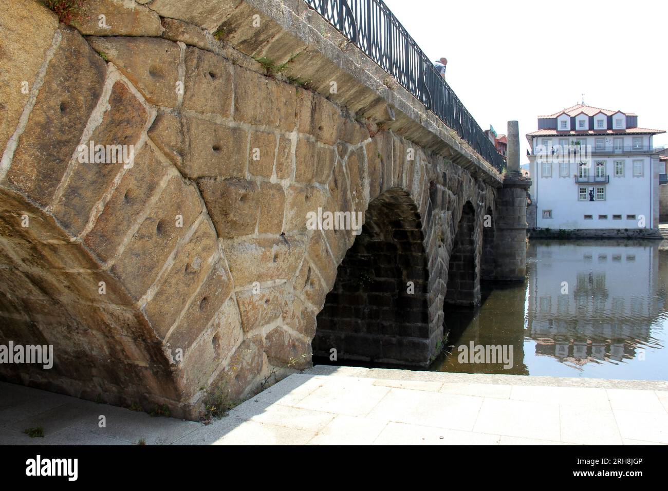 Roman bridge of Emperor Trajan crossing the Tamega river, stone arches ...
