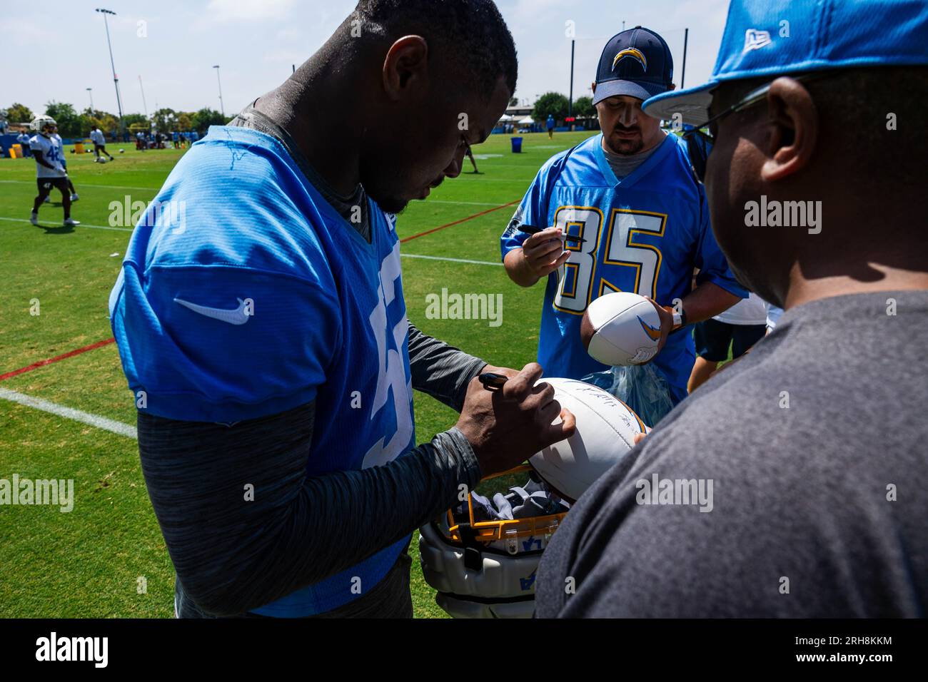 Los Angeles Chargers line backer Khalil Mack (52) give autographs to ...