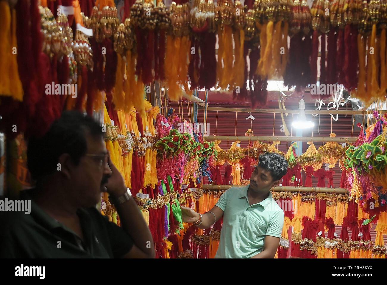A shop owner arranging "Rakhi", sacred threads for the upcoming "Raksha ...
