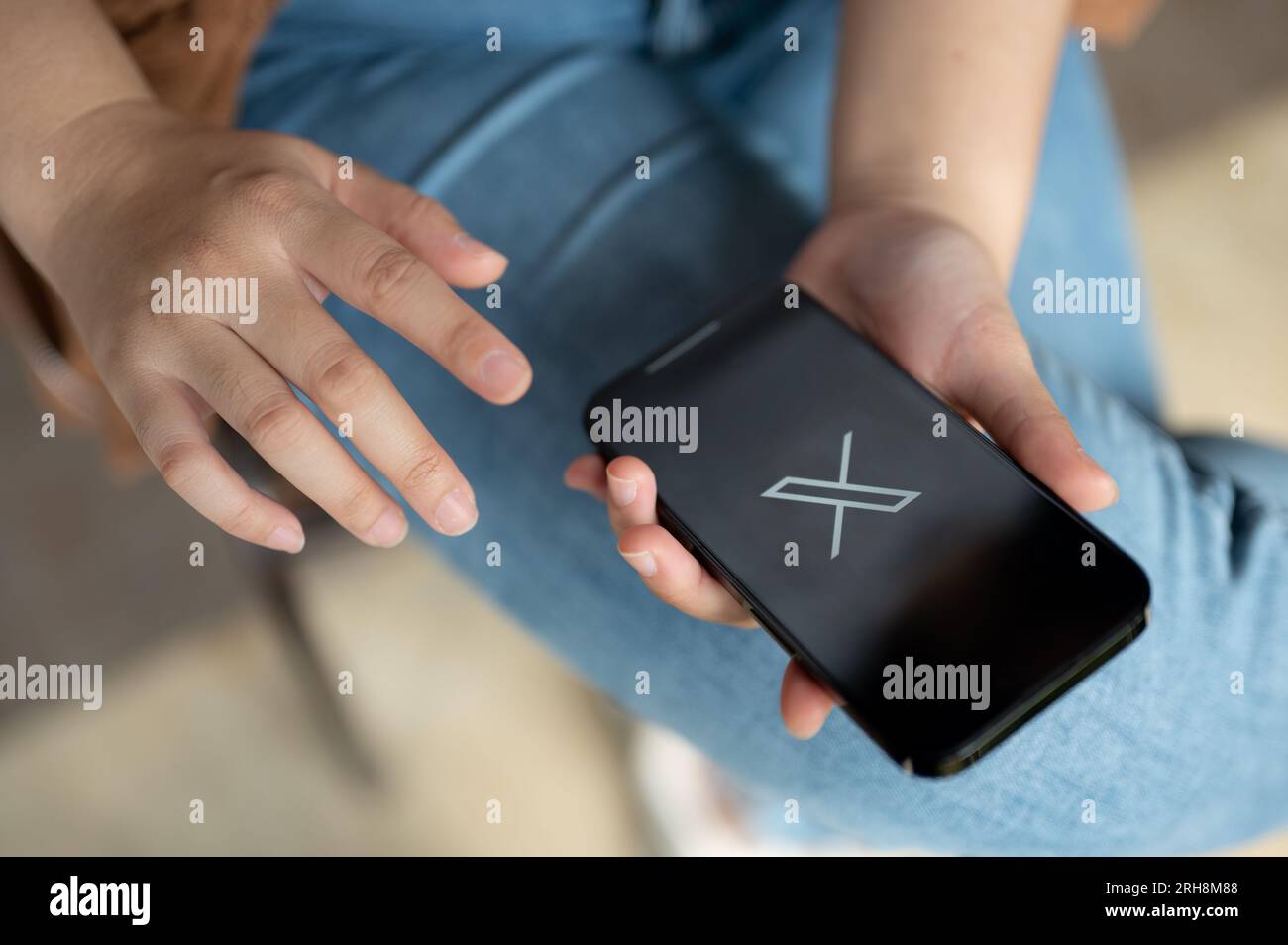 Chiang Mai, Thailand - Aug 14 2023: A female using X new twitter ...