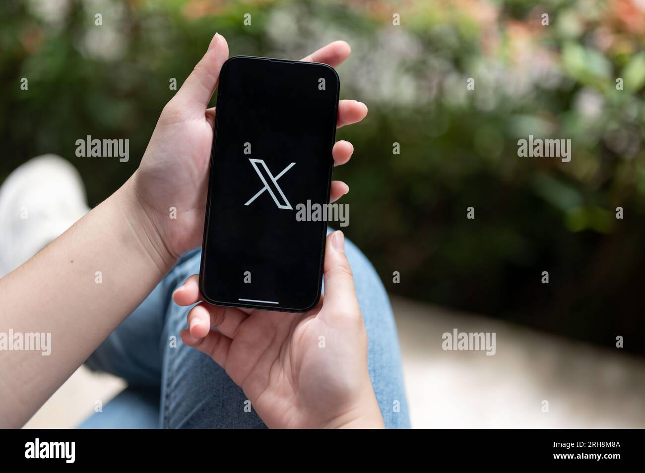 Chiang Mai, Thailand - Aug 14 2023: A female using X new twitter ...