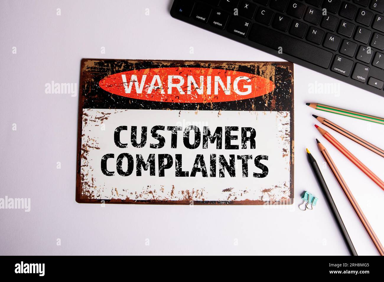Customer Complaints Concept. Warning sign and computer keyboard on ...