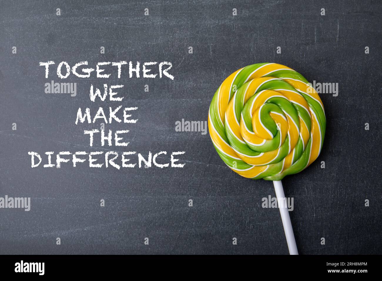 Together we make the difference. Text on a dark chalkboard background ...