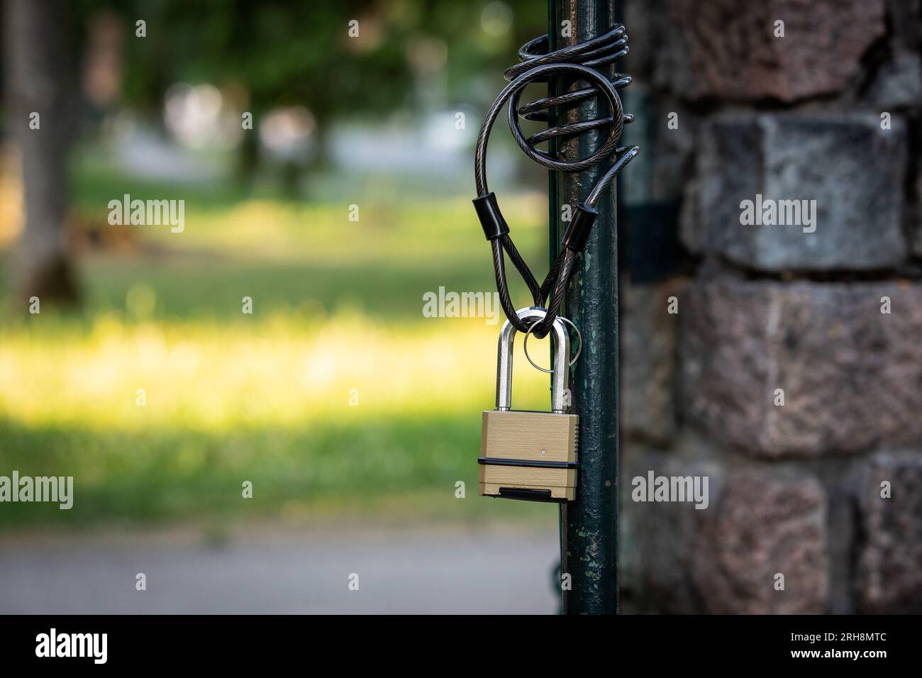 Open metal territory gate. Padlock with chain Stock Photo - Alamy