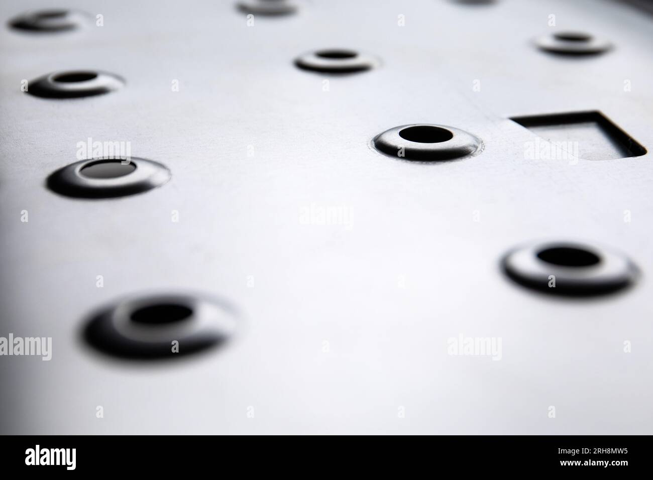 Galvanized metal plate surface with holes. Industrial style and ...