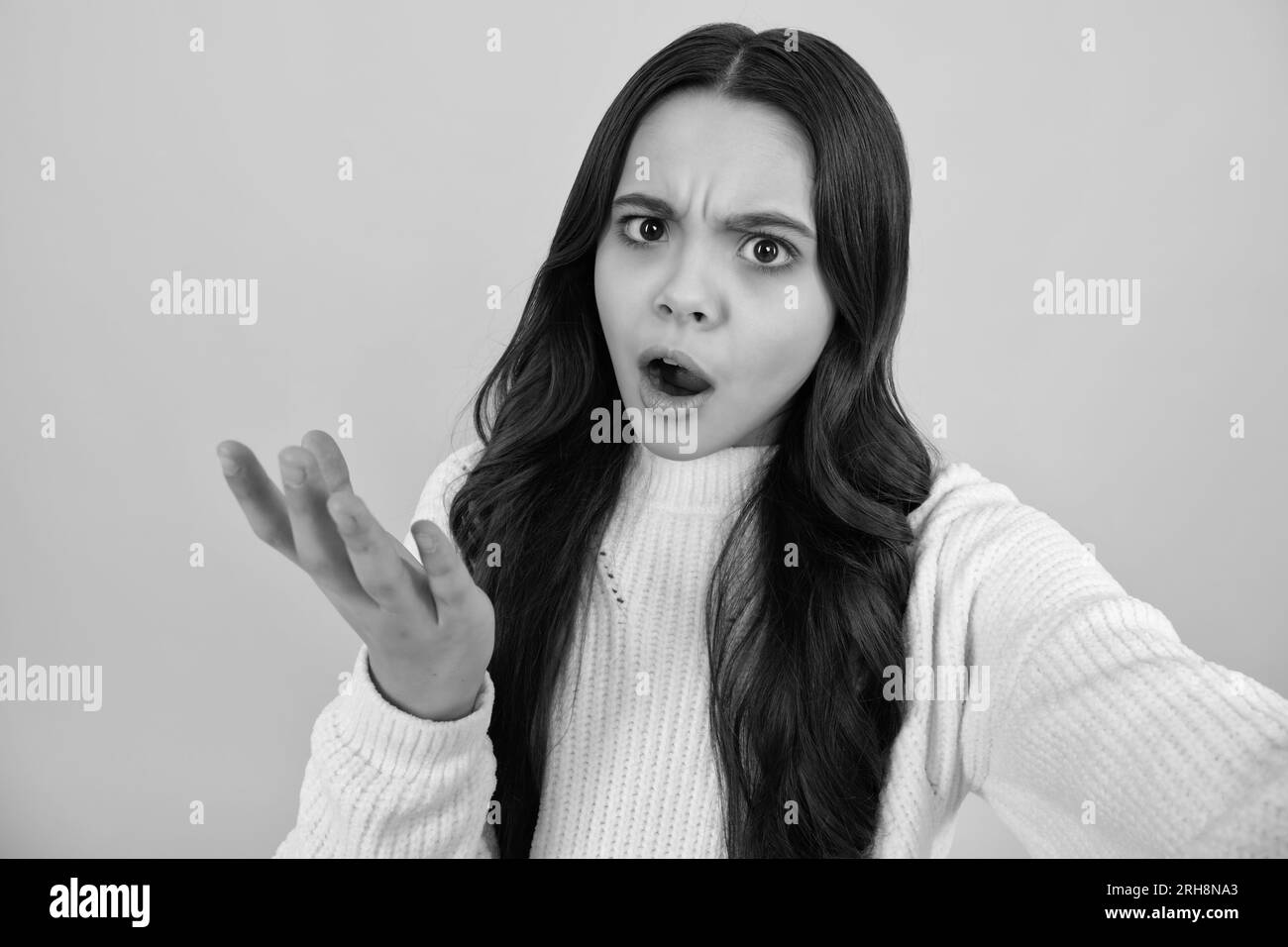 Teen girl making selfie posing on yellow background. Fashion teenager ...