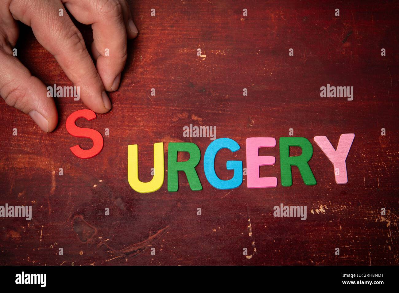 SURGERY Concept. Text from colorful alphabet letters on wooden table ...