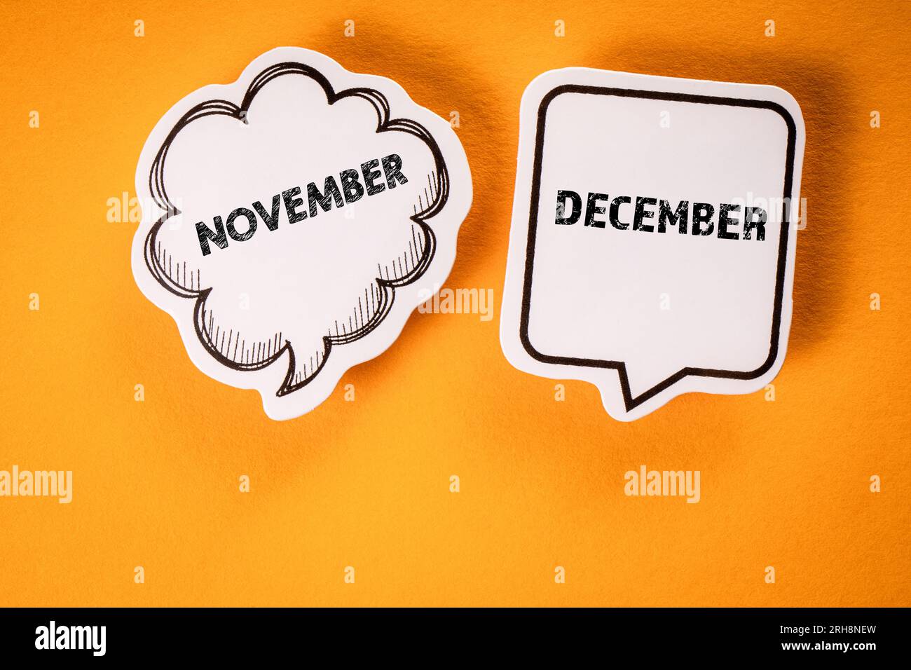 November and December. Two speech bubbles on a yellow background Stock ...