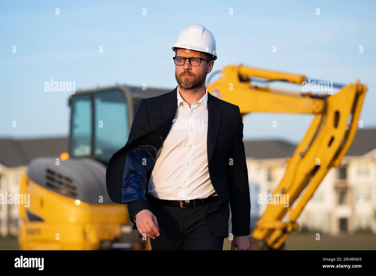 Civil engineer worker at a construction site. Engineer man in front of ...