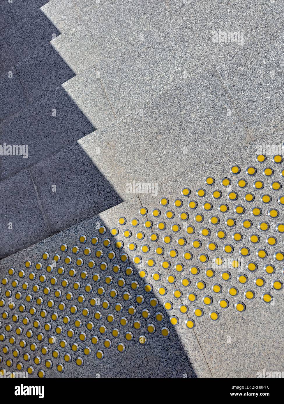 yellow tactile indicators on stairs for visually impaired people ...