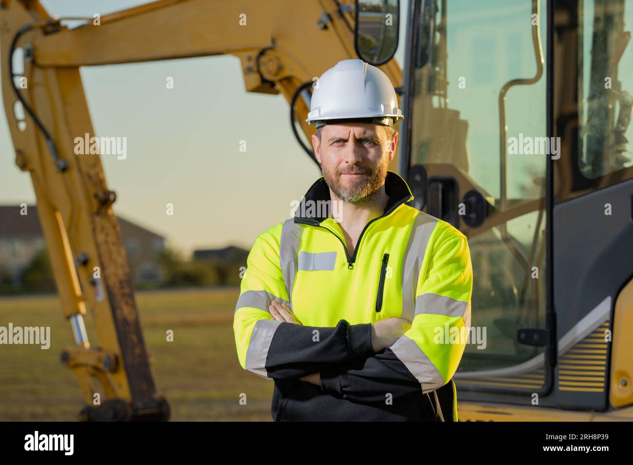 Builder with excavator for construction at the construction site ...