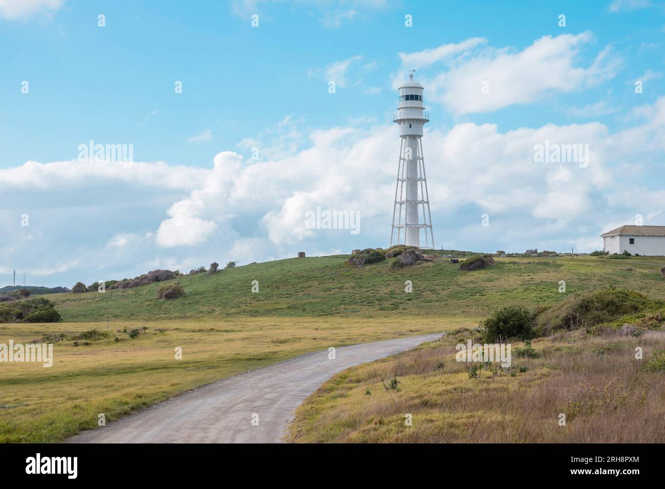 Photograph of a dirt track leading up to Currie Lighthouse on a hill ...