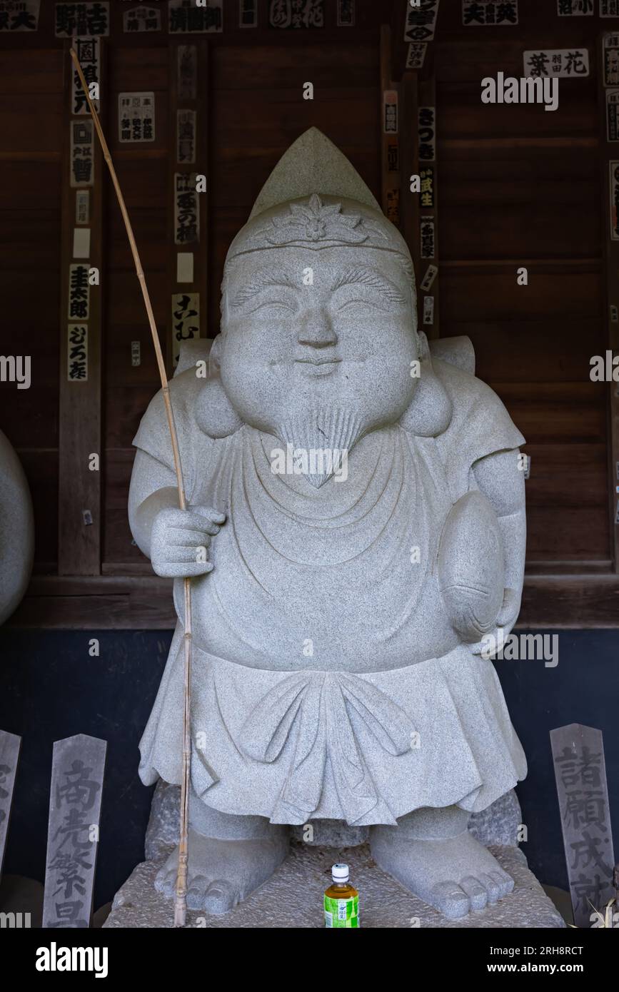 A Japanese guardian statue at the traditional street in Tokyo Stock ...